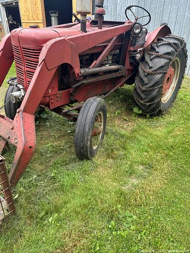 McCormick Super W4 farm tractor with loader and extra implement | Maxsold
