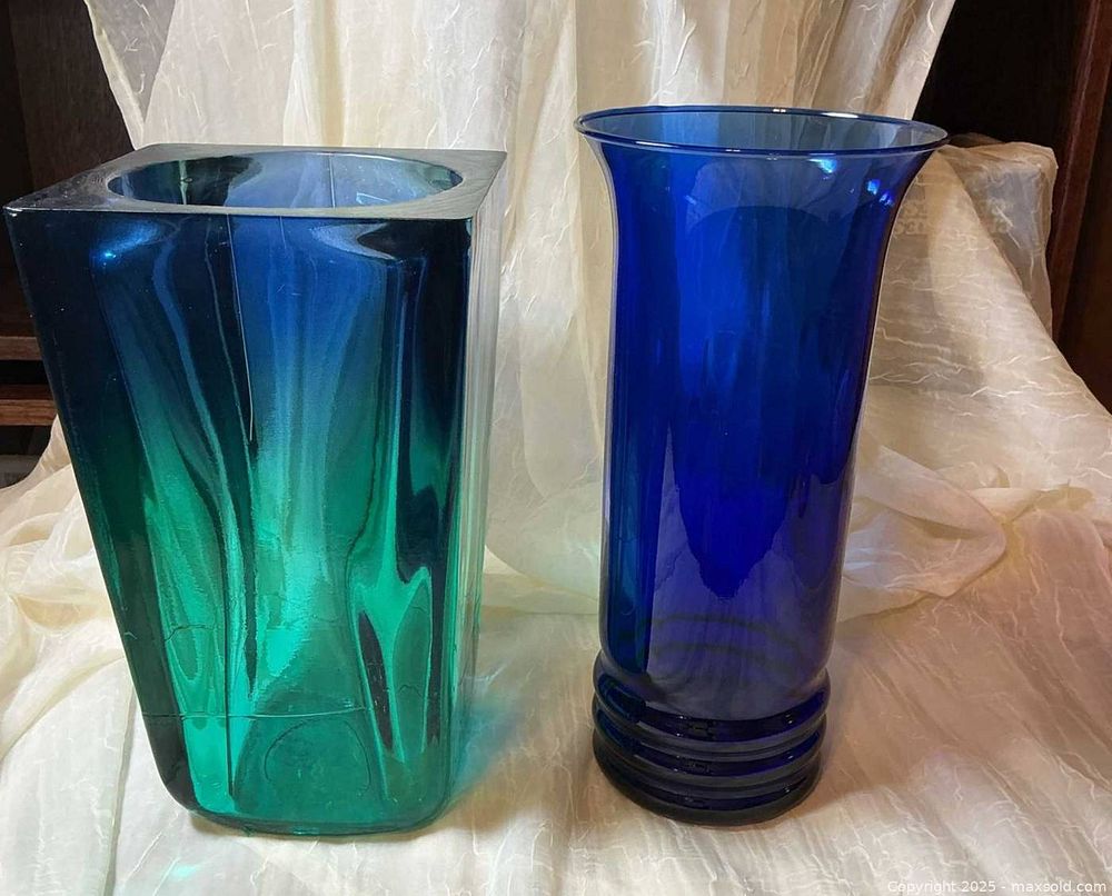 Two tall colored glass vases | Maxsold
