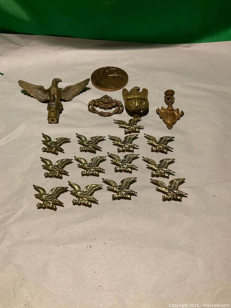 Brass eagle flagpole finial, 16 brass eagle pins, assorted brass ...