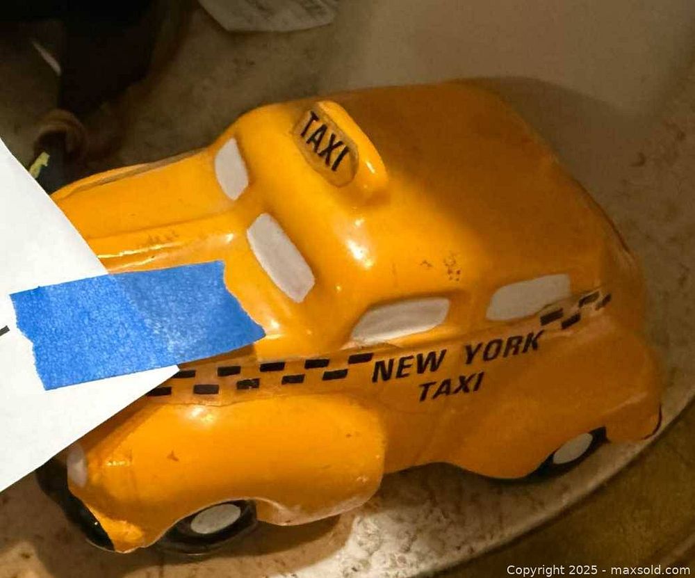 Ceramic New York yellow taxi coin bank | Maxsold