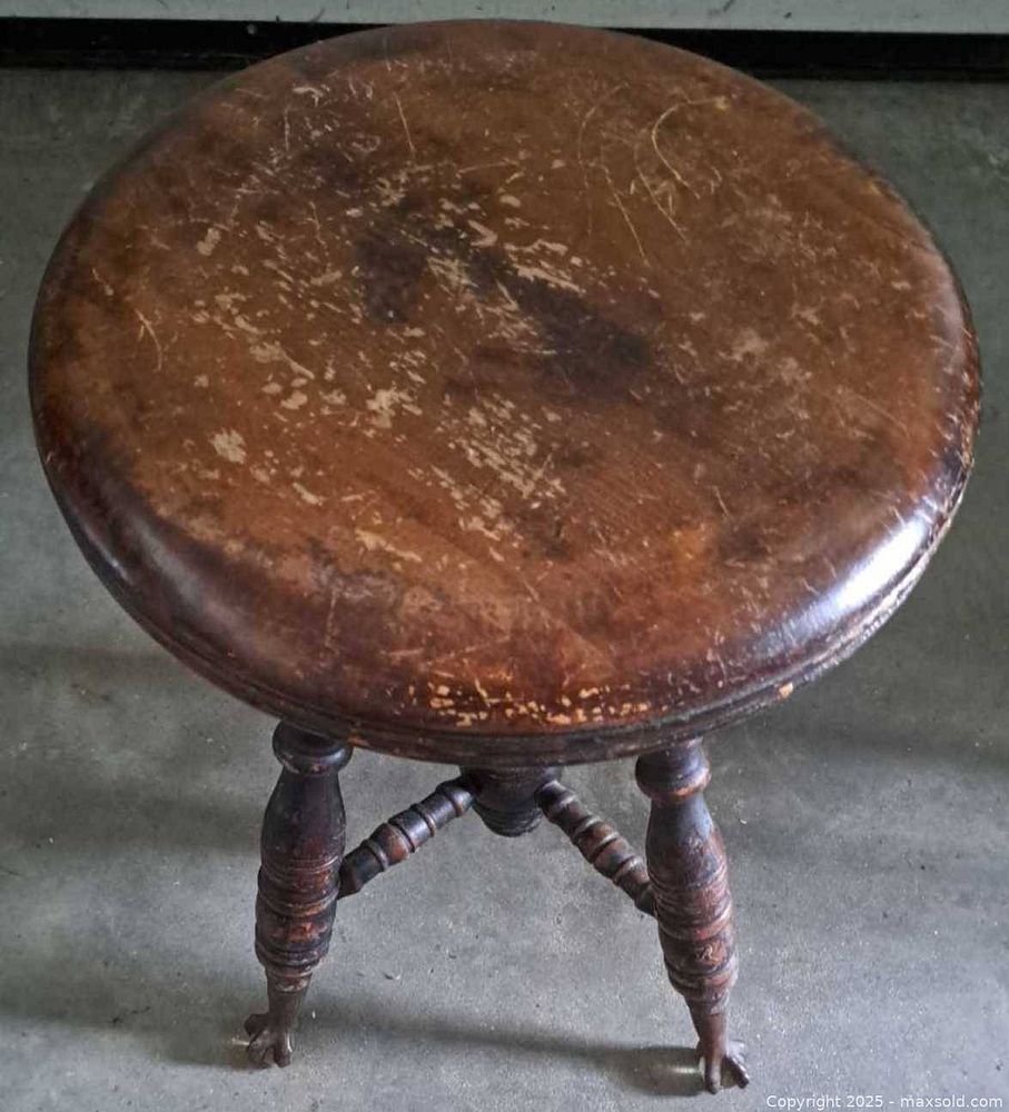 Wooden piano stool with claw feet | Maxsold