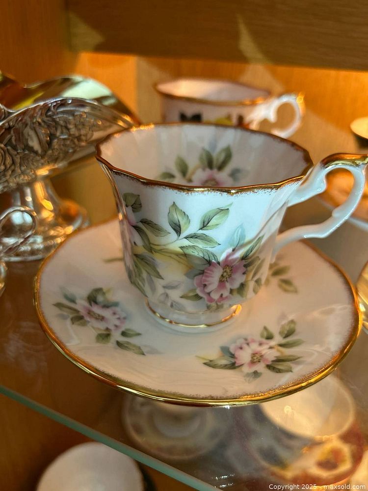 Assorted bone china teacups, saucers, silverplate scoops | Maxsold