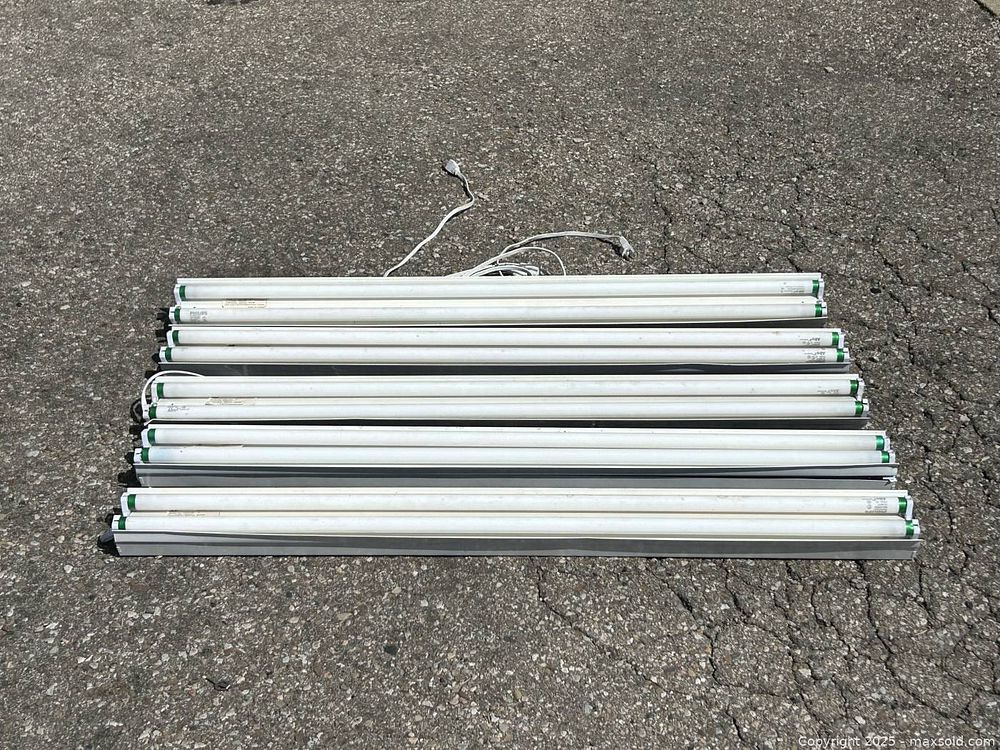 Five 48" plug-in fluorescent light fixtures | Maxsold
