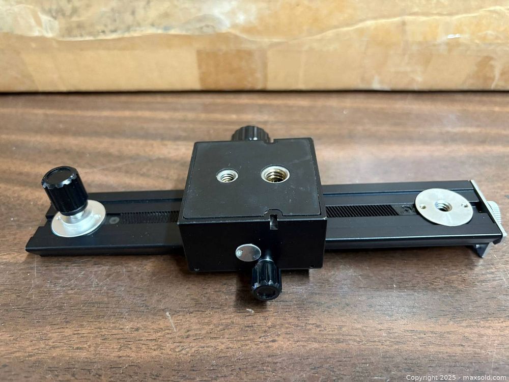 Camera tripod ball heads, focusing rack and hardware | Maxsold