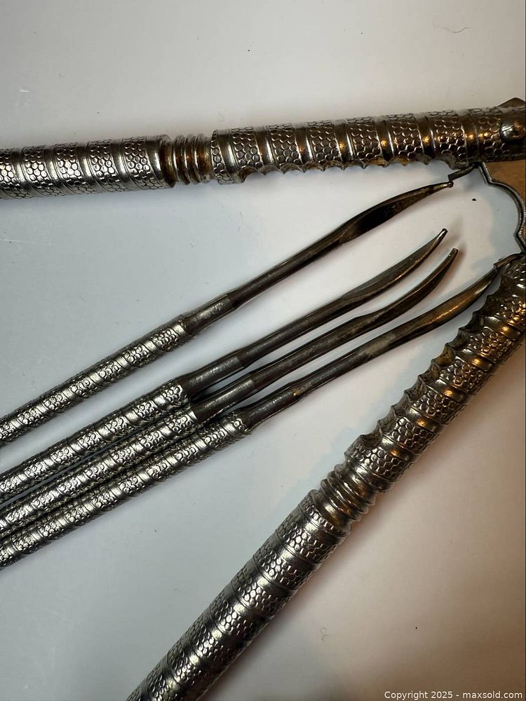 Vintage HMQ metal nutcracker set | Maxsold