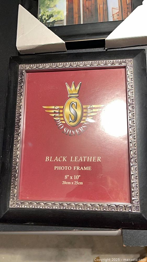 Eight assorted black photo frames | Maxsold