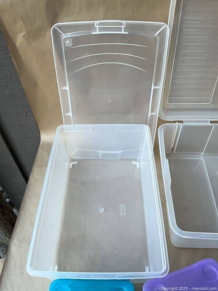 Five plastic storage tubs | Maxsold