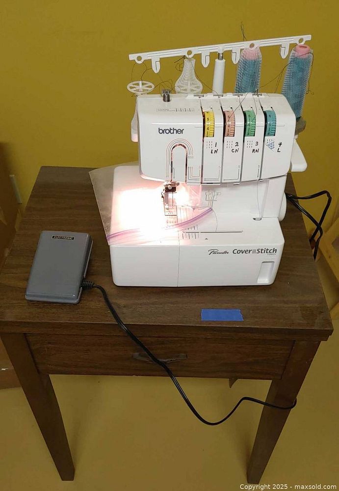 Vintage wood sewing cabinet with Brother Coverstitch machine and fabric ...