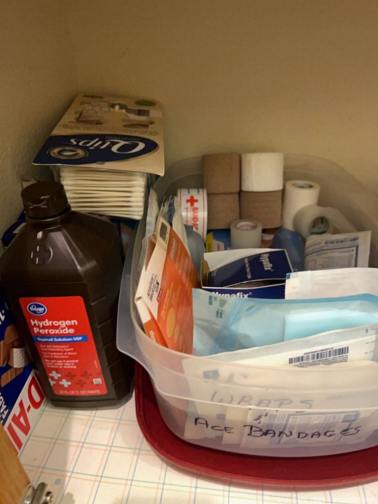 Assorted first-aid supplies with storage bins | Maxsold