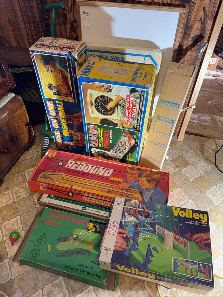 Vintage board games with green pogo stick | Maxsold
