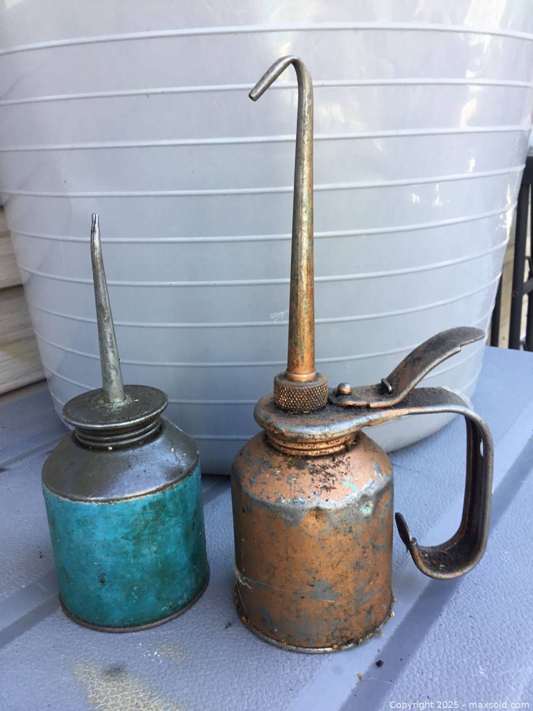Pair of vintage metal oil cans | Maxsold