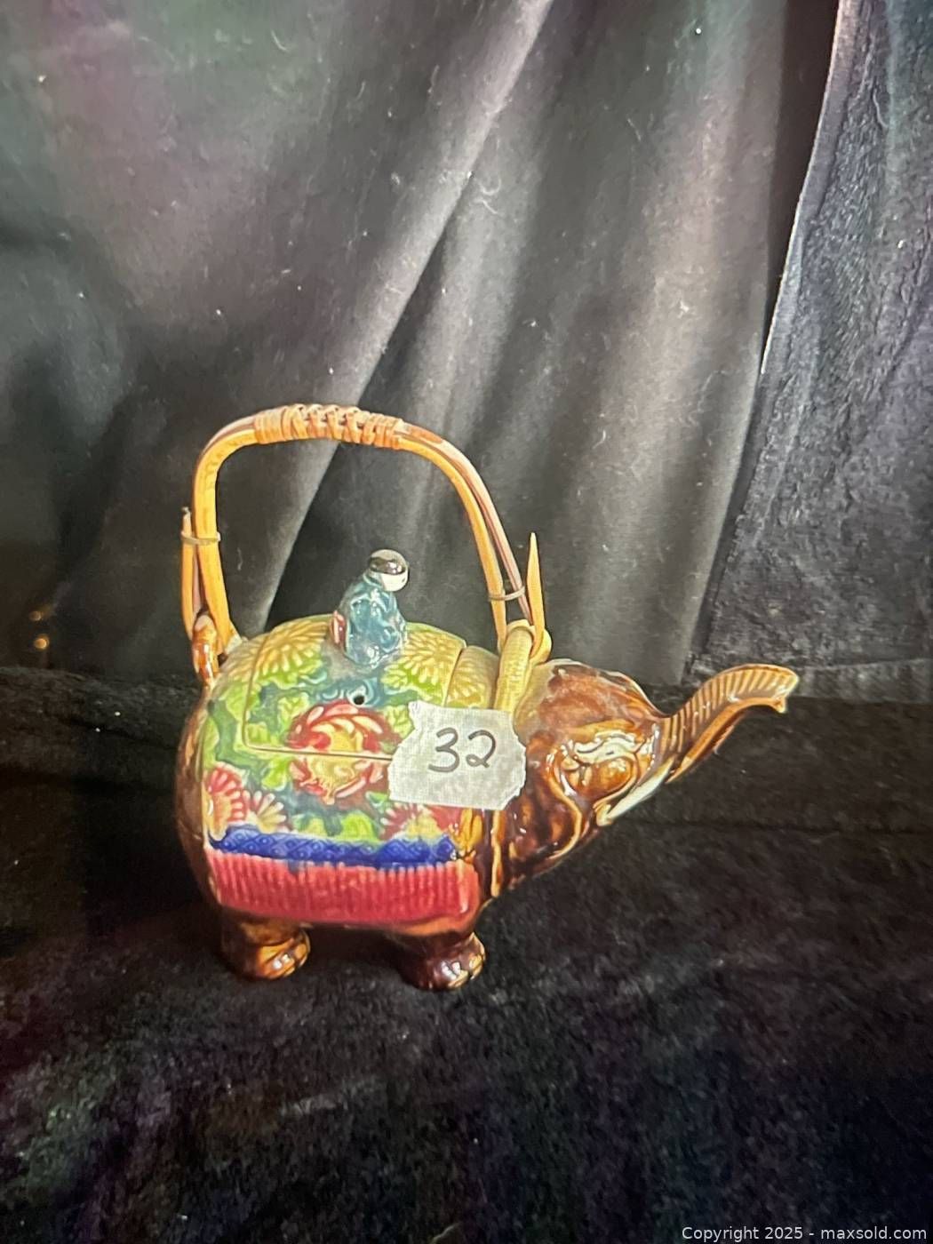 Elephant shaped ceramic teapot with rattan handle | Maxsold