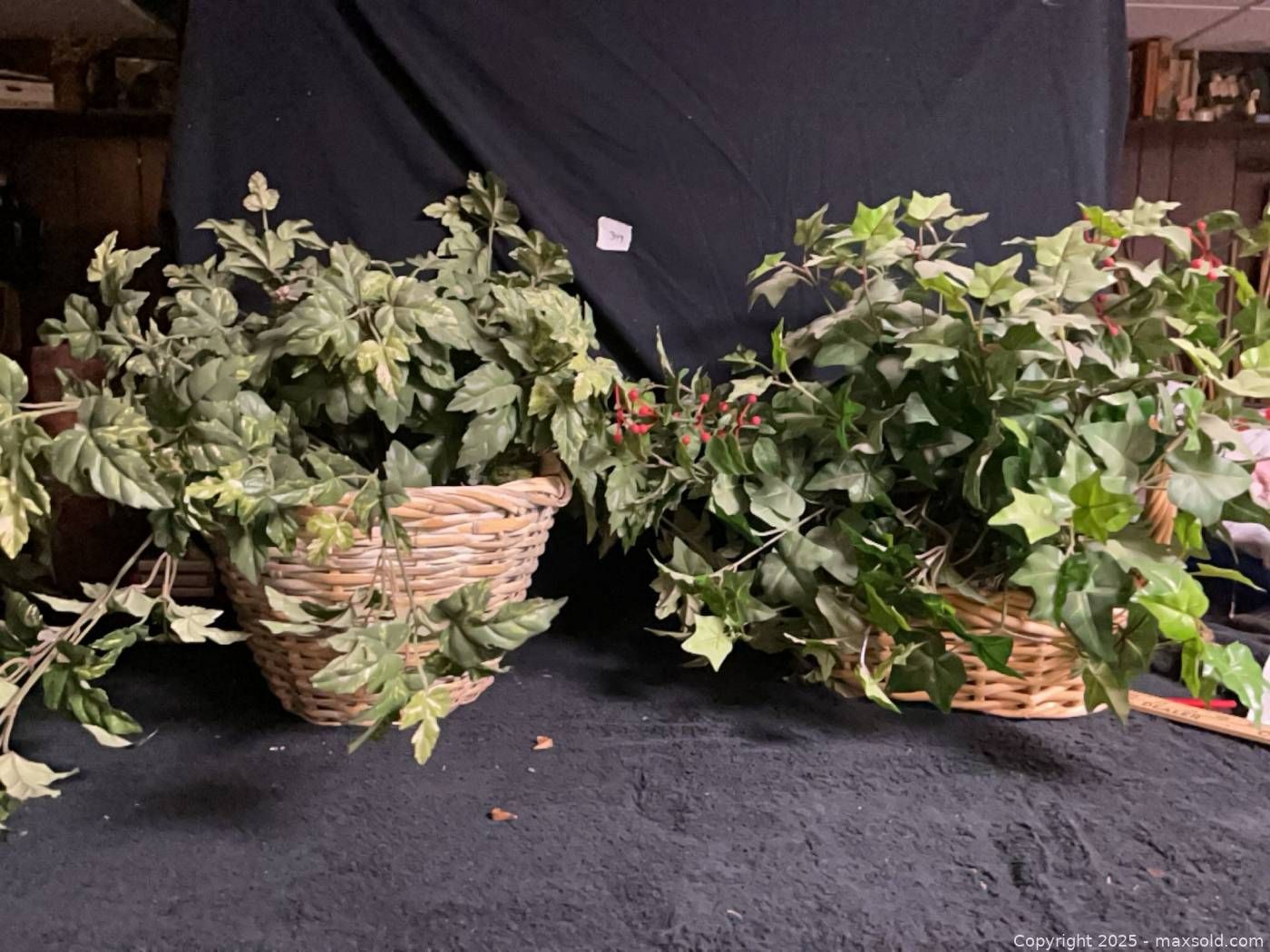 Lot of 2 artificial ivy potted greenery in wicker baskets | Maxsold