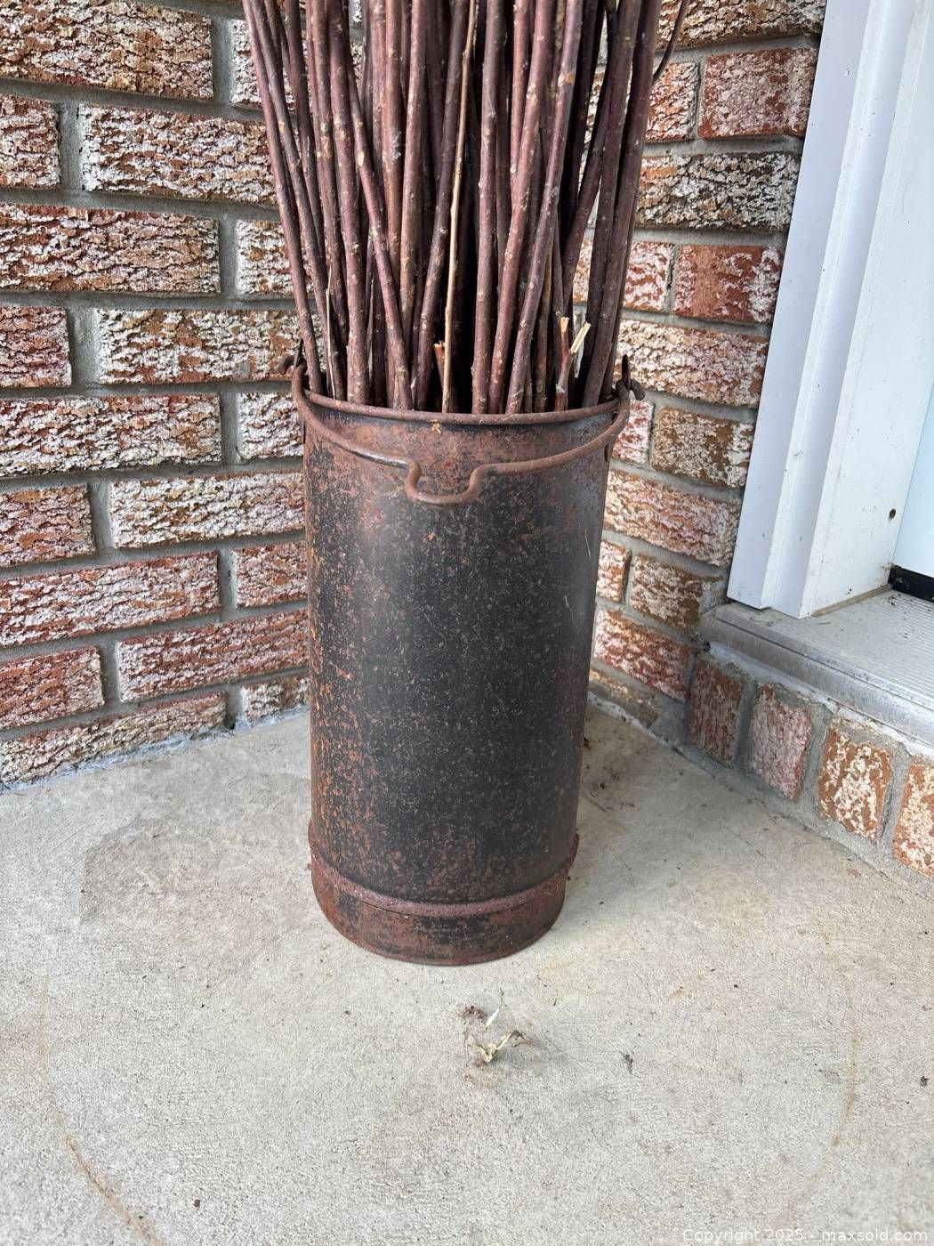 Natural wood branches bundle with metal pail | Maxsold