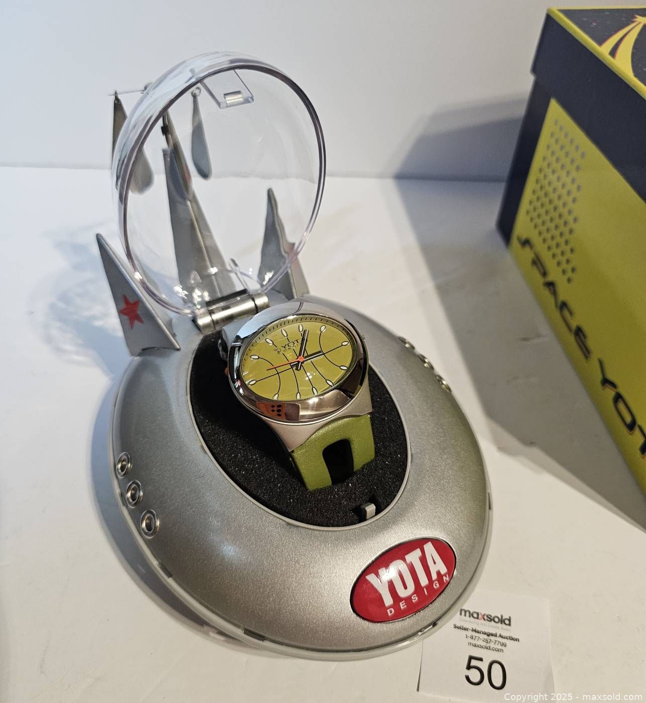 Space Yota watch with spaceship tin display | Maxsold