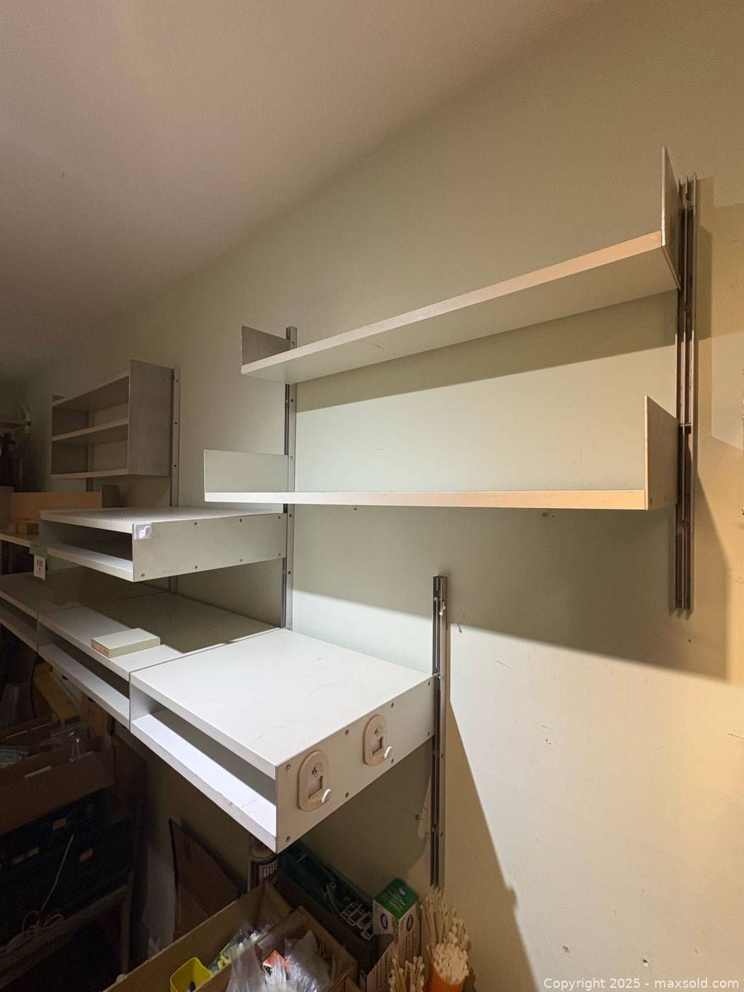 Vintage wall-mounted modular shelving system | Maxsold