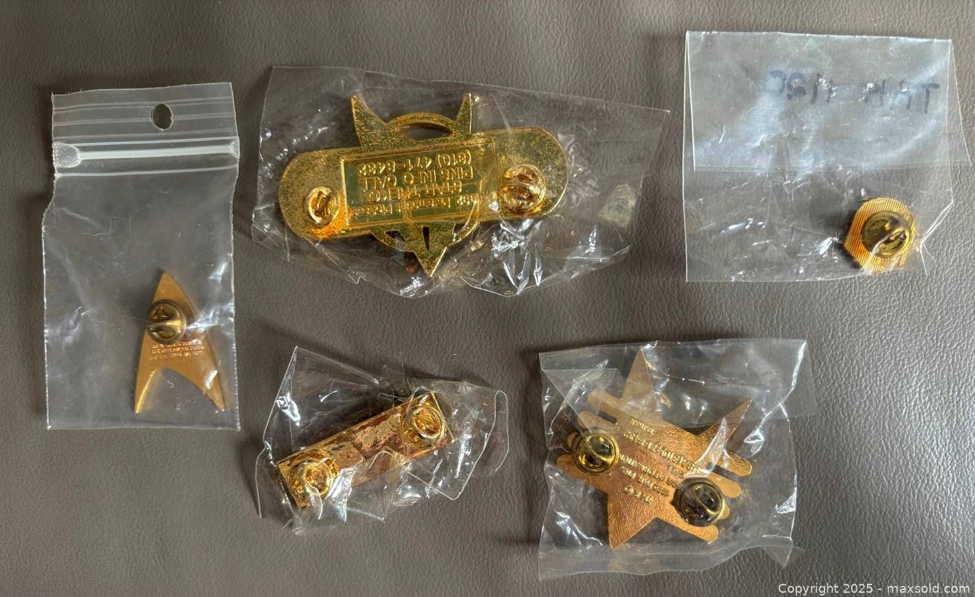Five sealed Star Trek metal badges | Maxsold