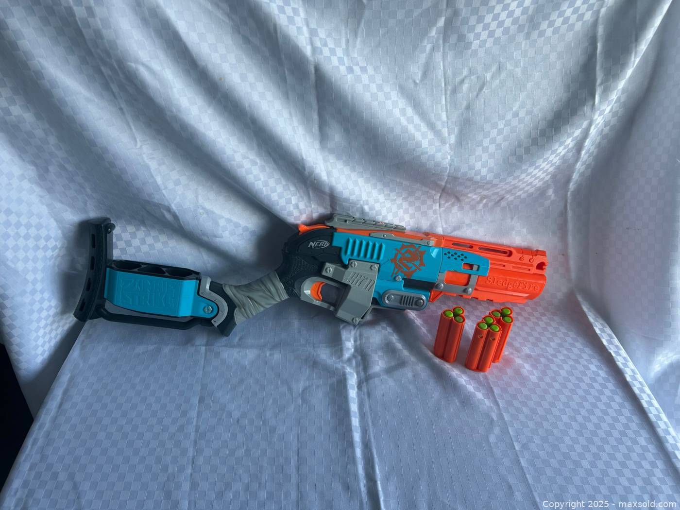 Nerf Zombie Strike Sledgefire blaster with 3 shells | Maxsold