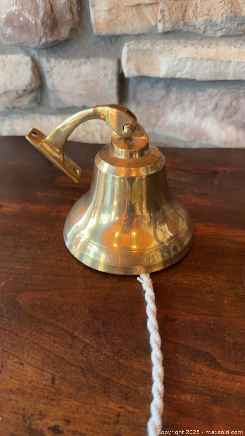 Hand-cast brass wall-mount bell with rope pull | Maxsold