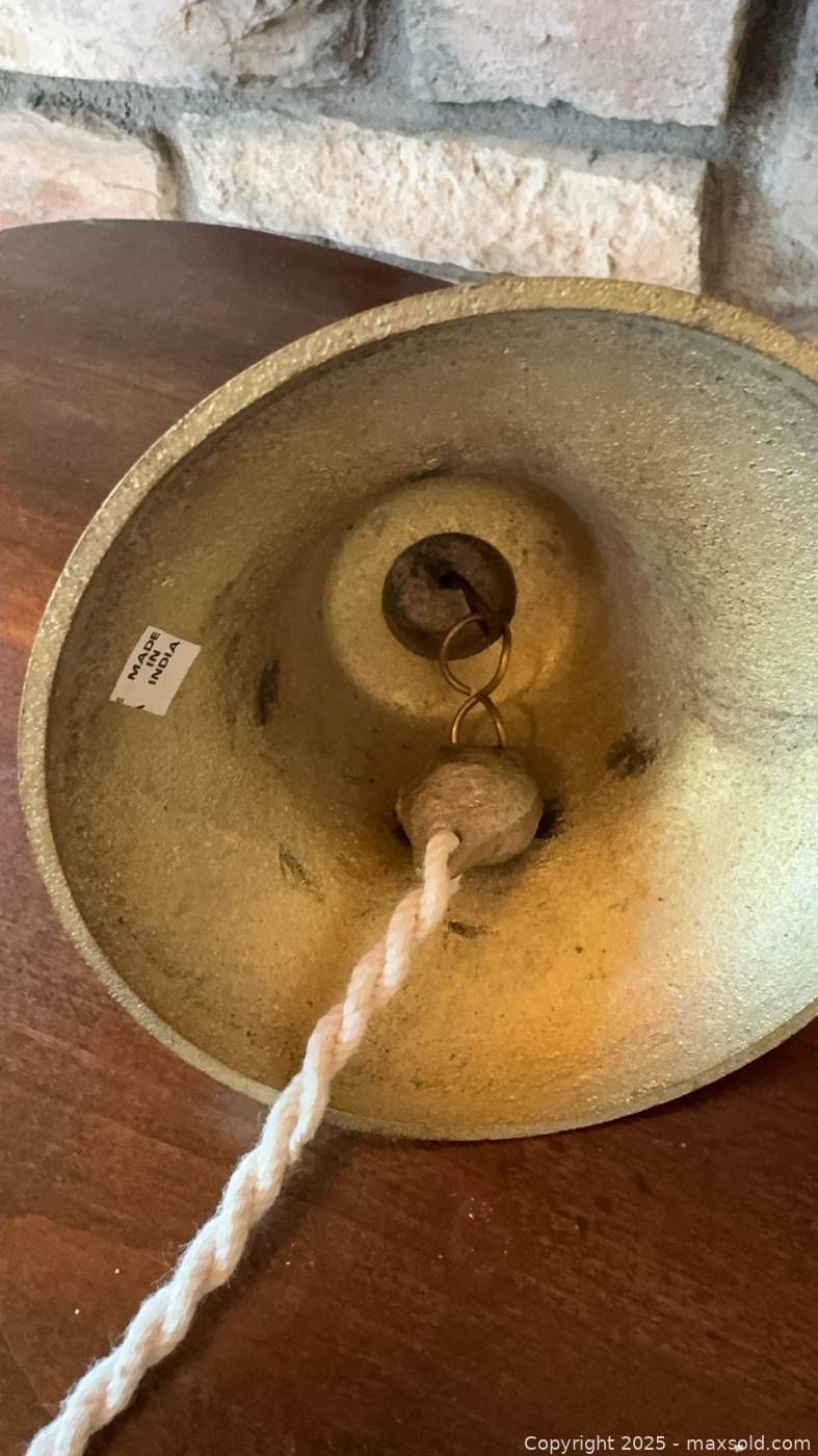 Hand-cast brass wall-mount bell with rope pull | Maxsold