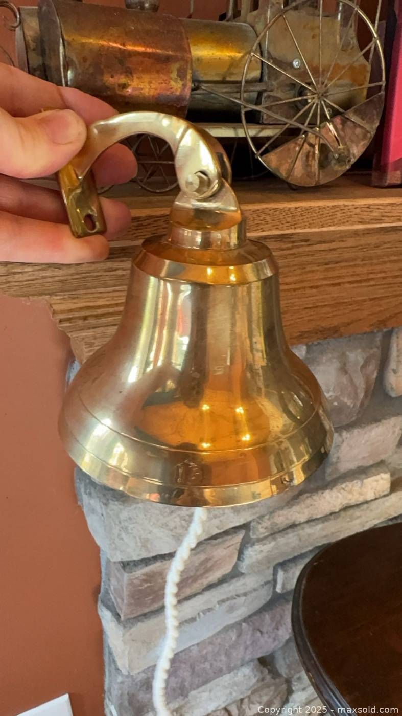 Hand-cast brass wall-mount bell with rope pull | Maxsold