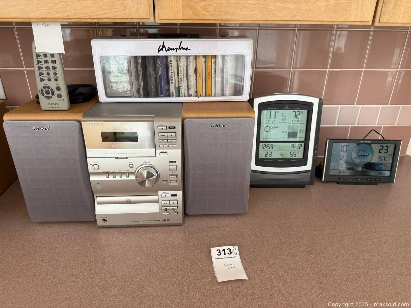 Sony CMT-CP1 stereo system, two Acu-Rite weather stations, CD holder ...