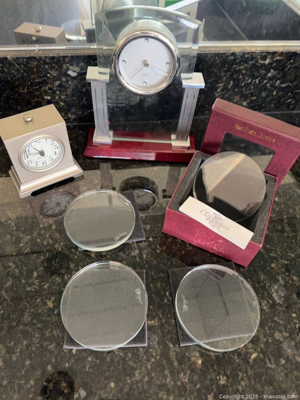 Oleg Cassini crystal coasters and desk clocks | Maxsold