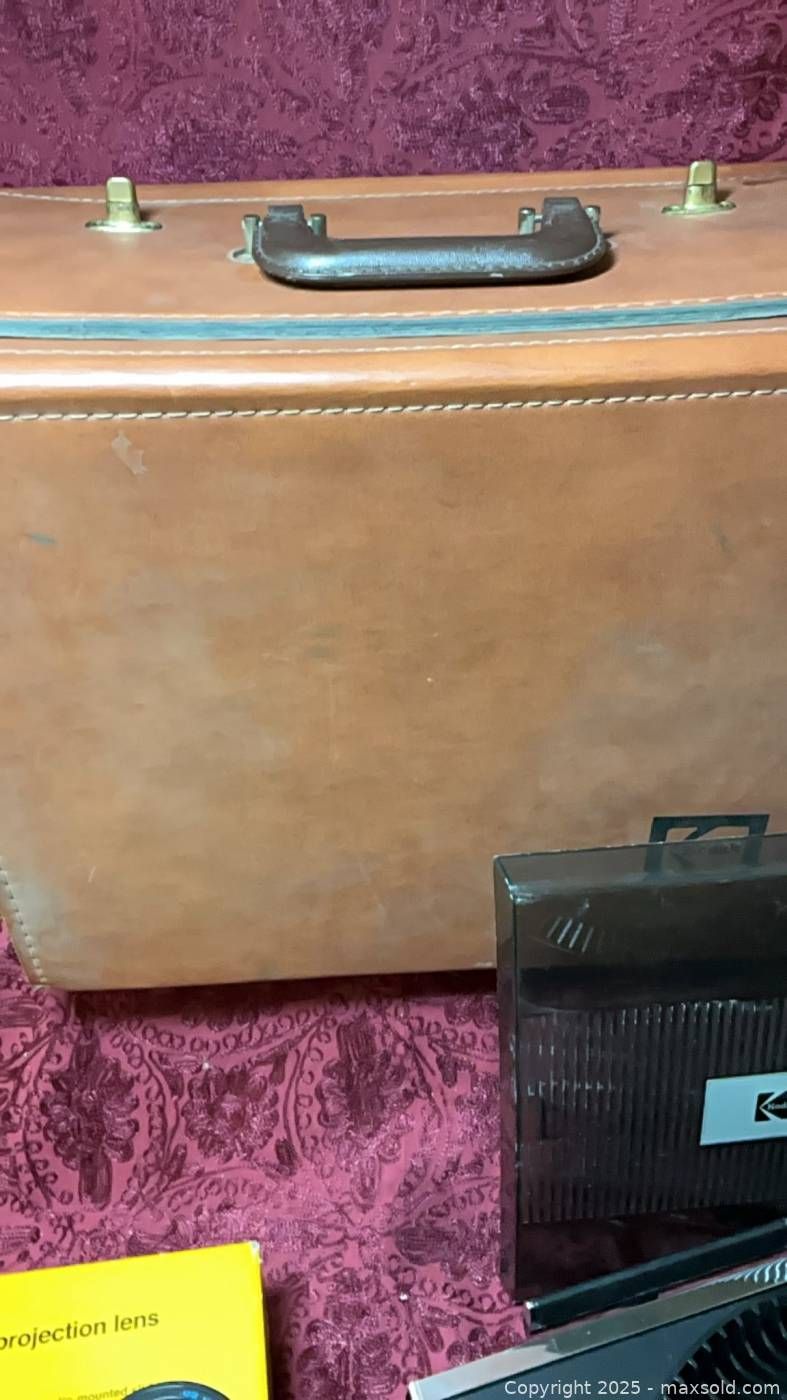 Kodak slide projector with case, lens, remotes, carousel | Maxsold