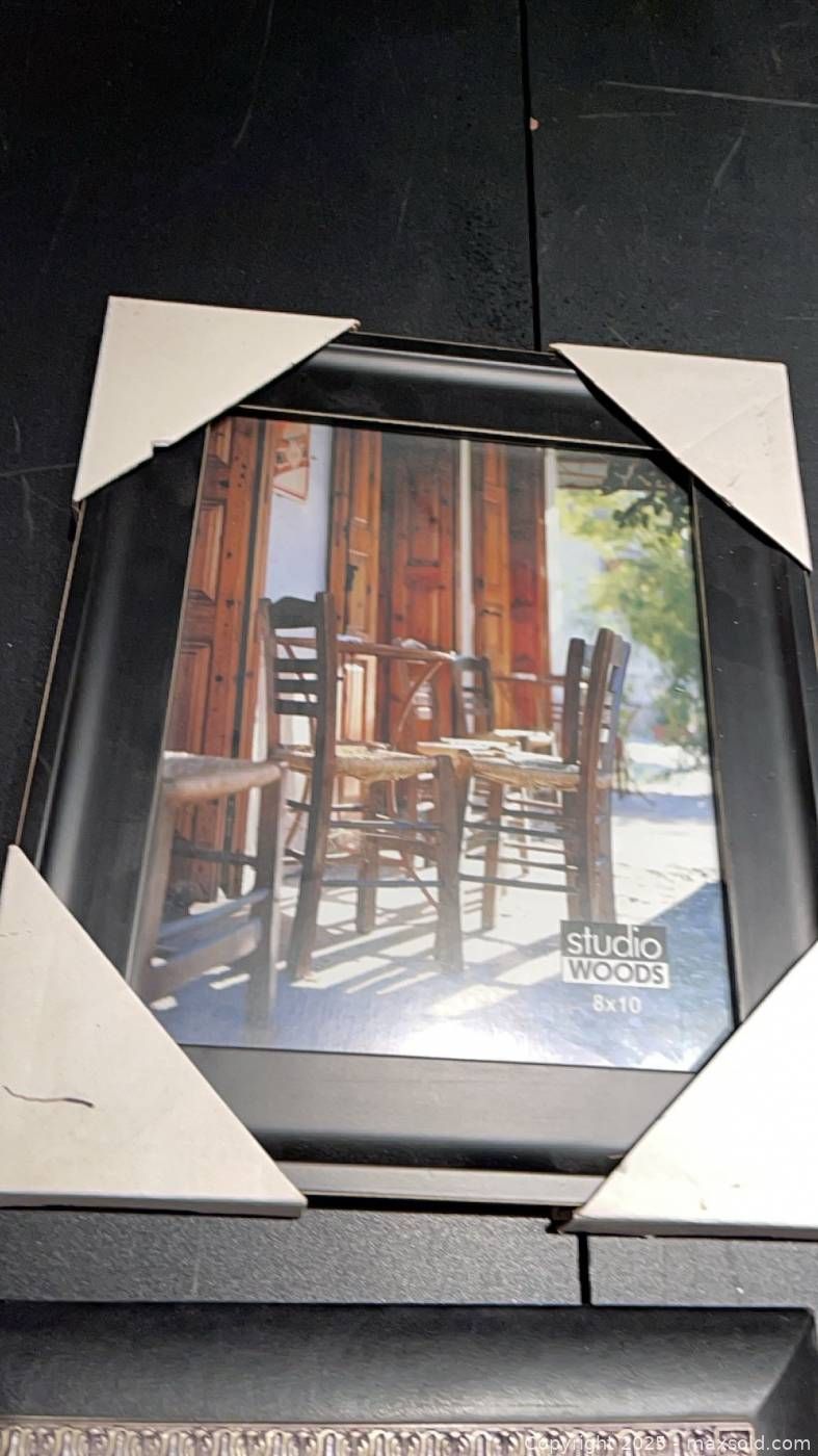 Eight assorted black photo frames | Maxsold