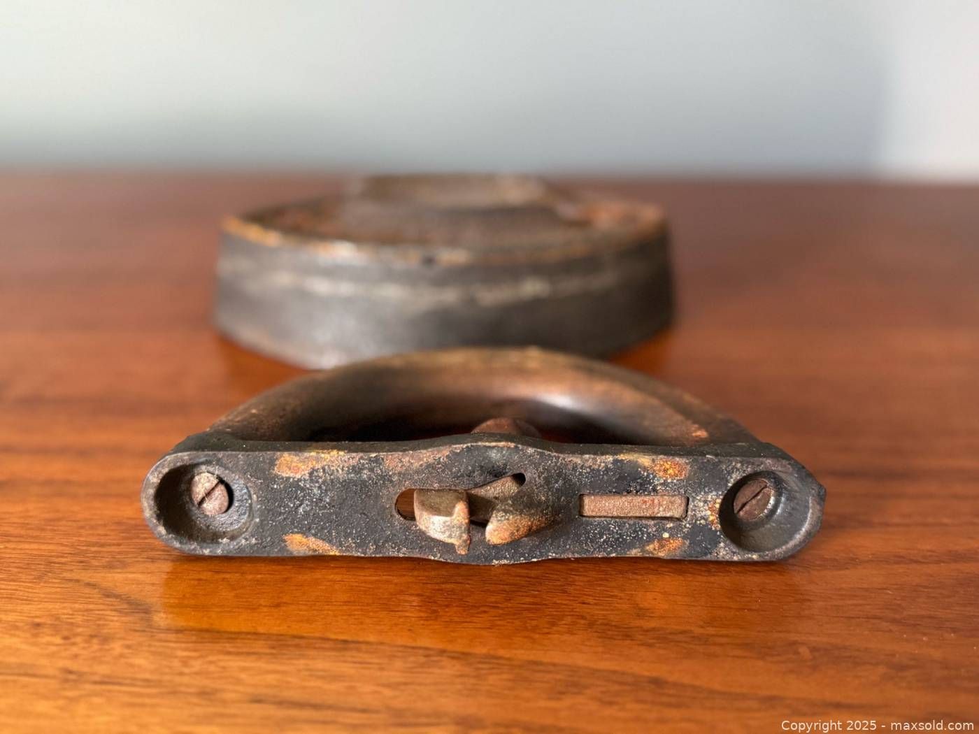 Antique cast iron sad iron with wooden handle | Maxsold