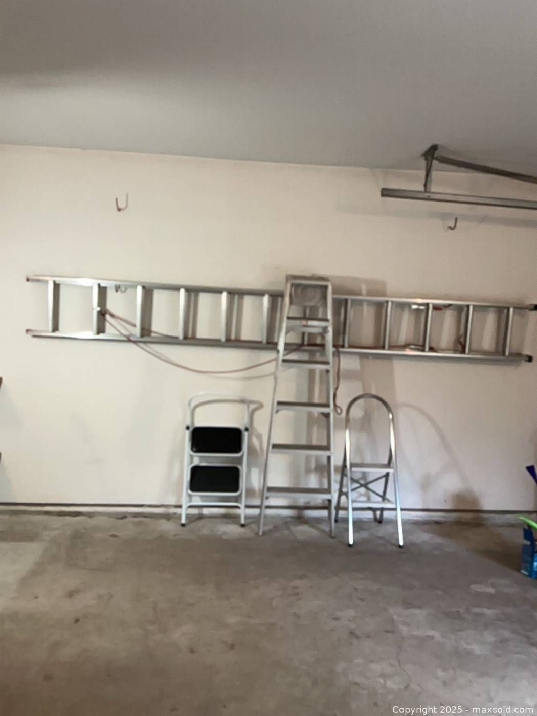 Aluminum extension ladder, 5-step ladder and two 2-step stools | Maxsold