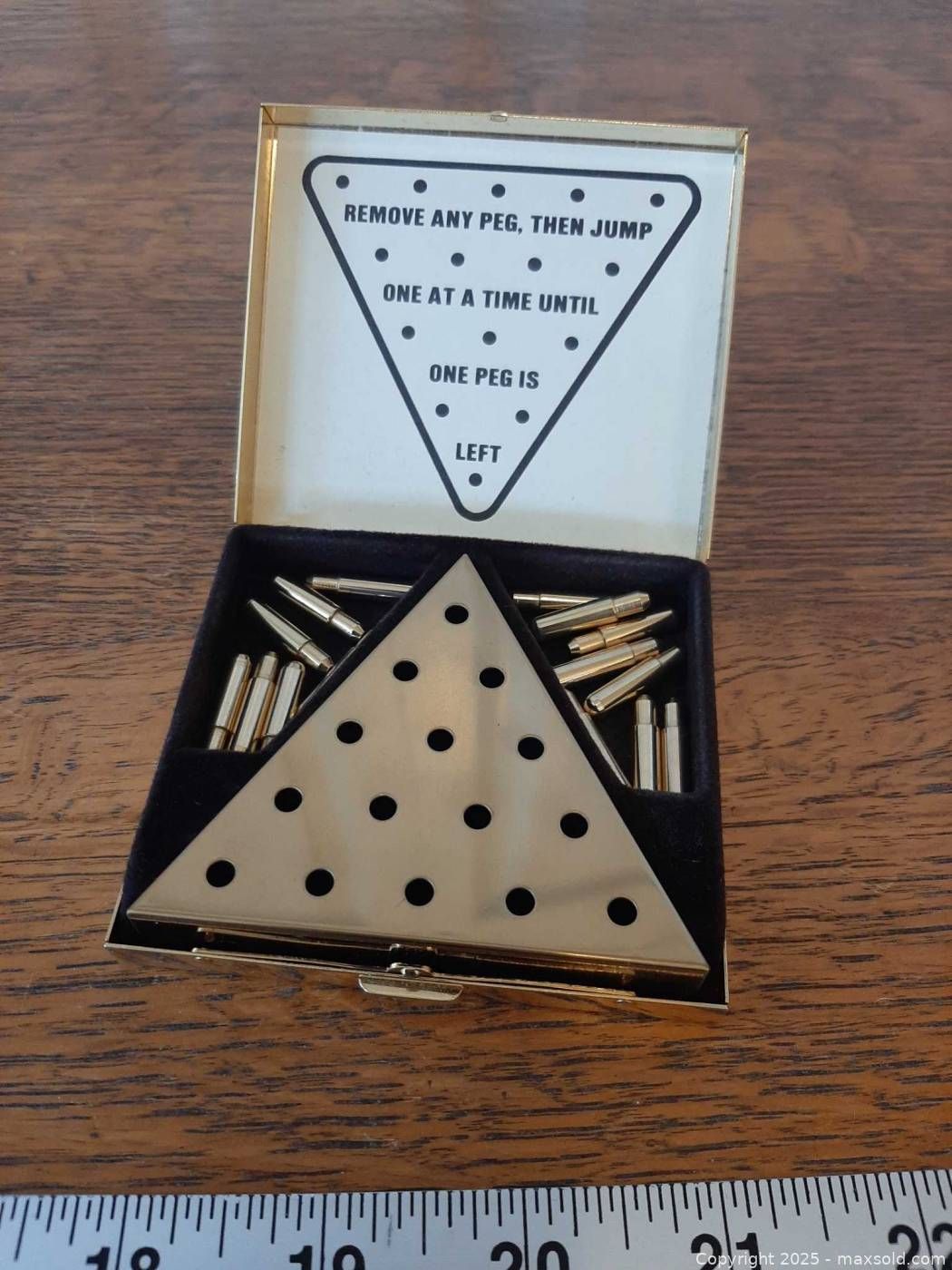 Vintage brass triangular peg solitaire game | Maxsold