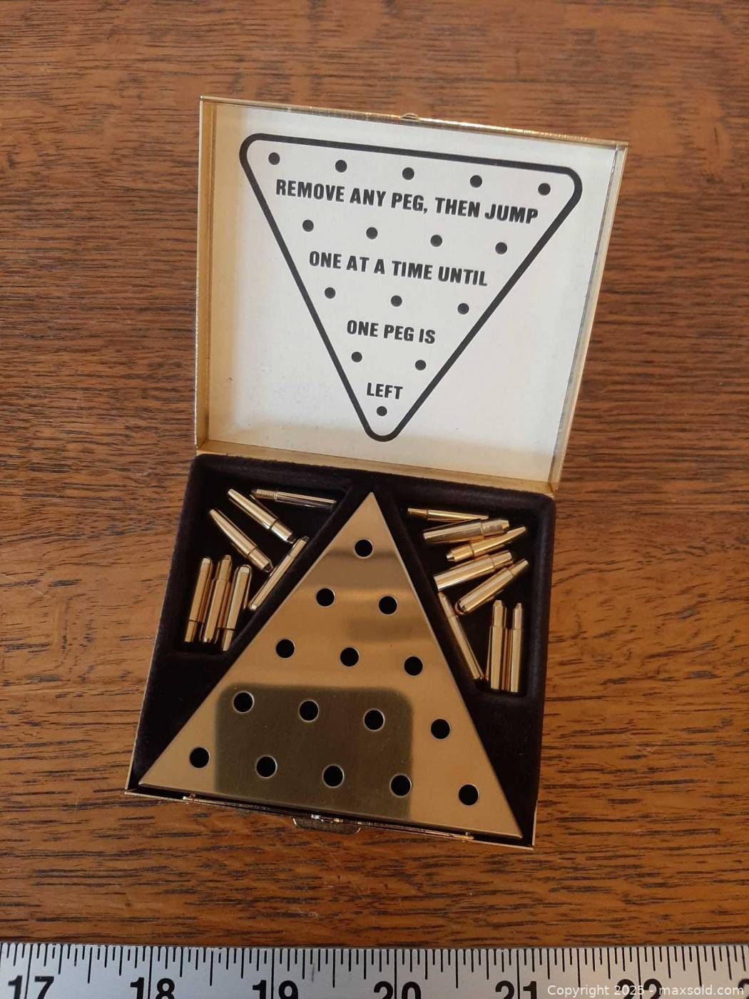 Vintage brass triangular peg solitaire game | Maxsold