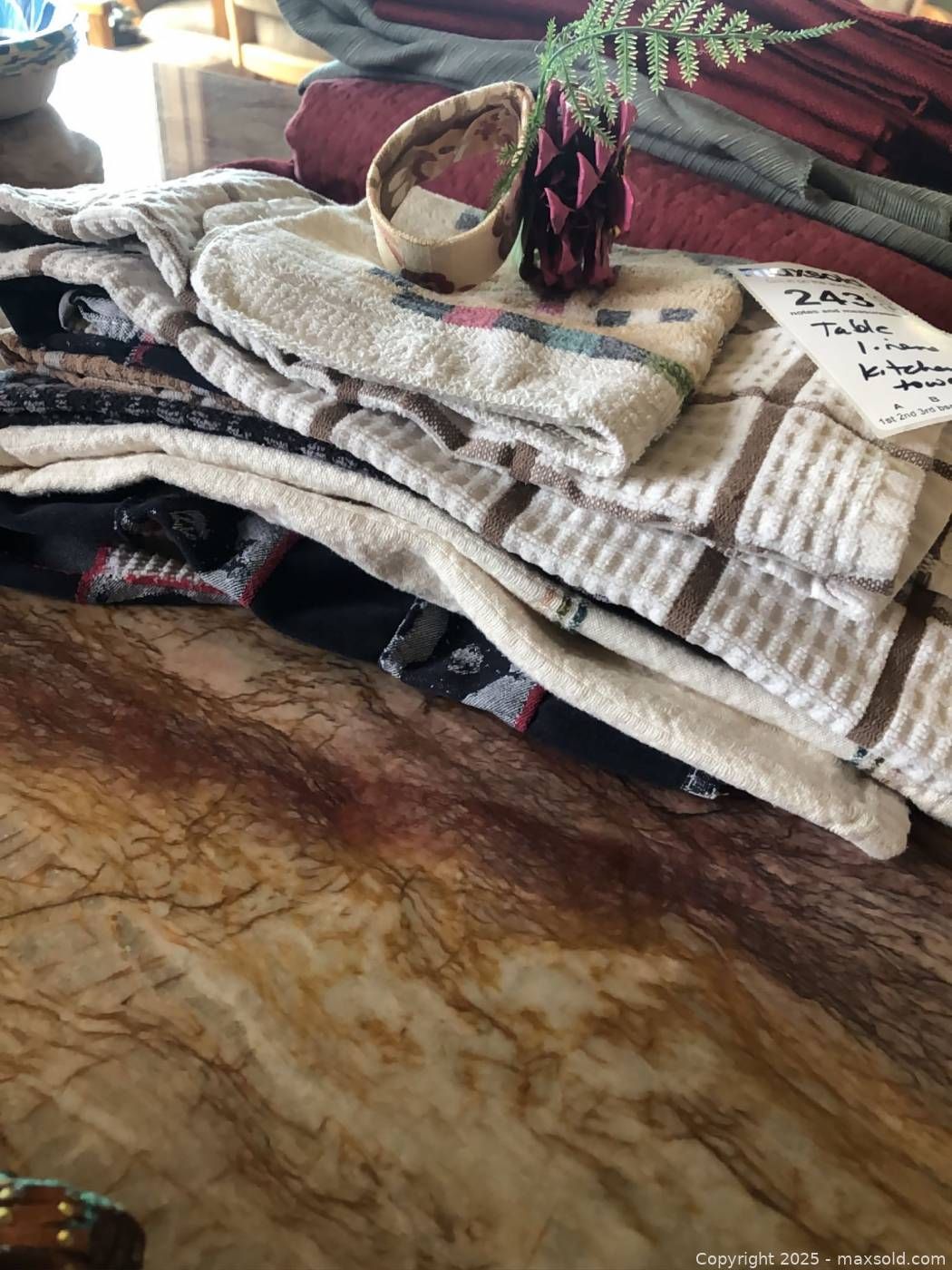 Red and sage table linens and kitchen towels | Maxsold