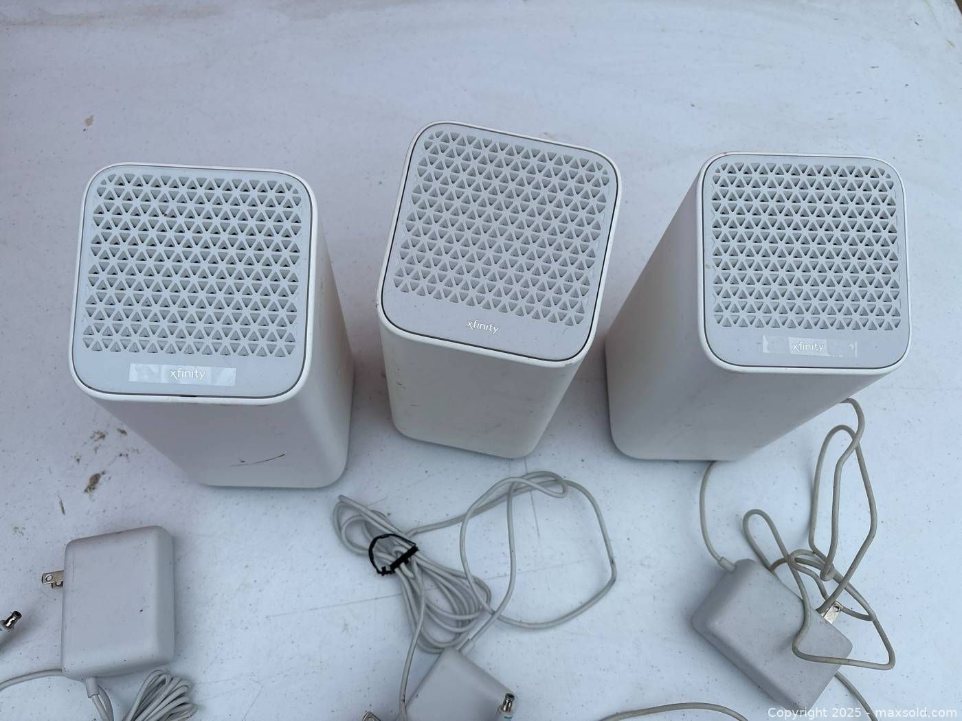 Three Xfinity WiFi gateway modem-routers with power adapters | Maxsold