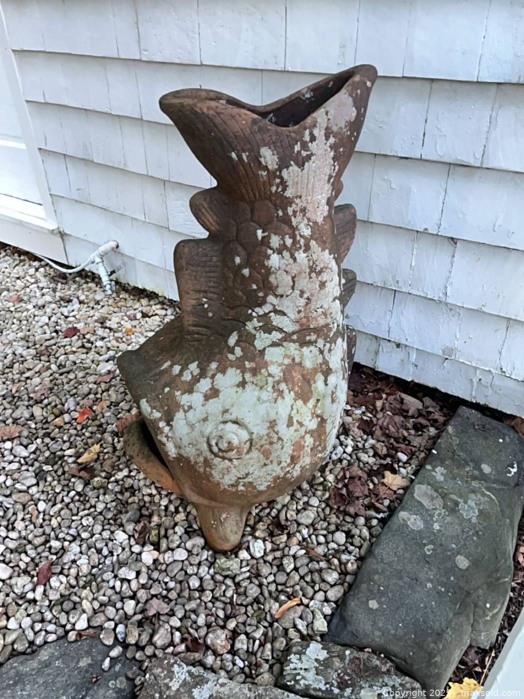 Terracotta fish-shaped outdoor chiminea | Maxsold