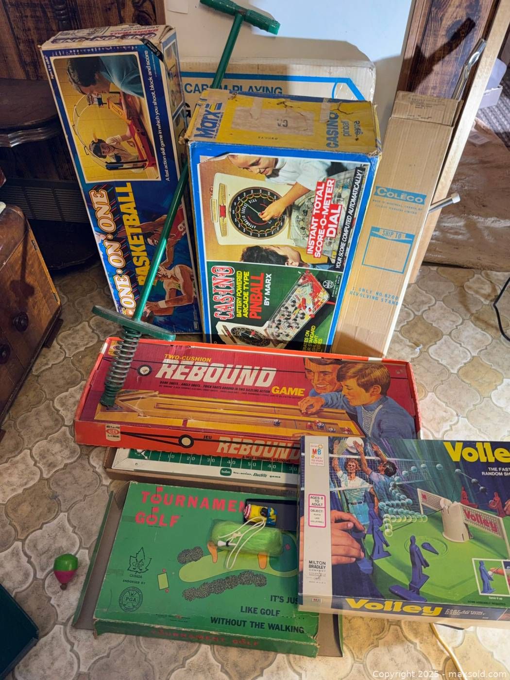 Vintage board games with green pogo stick | Maxsold