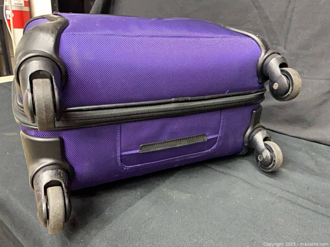 Purple Tumi wheeled carry-on luggage | Maxsold