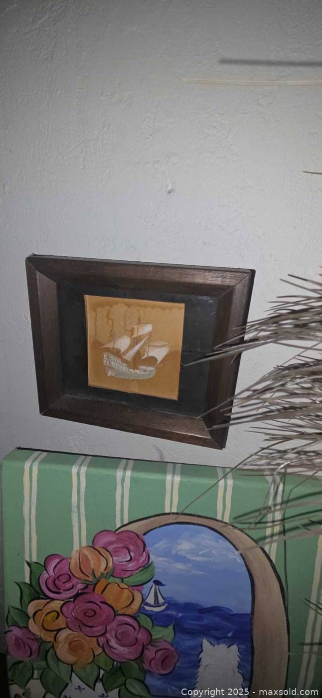 Painting, headphones, basket, faux flowers, vase, framed sailboat art ...