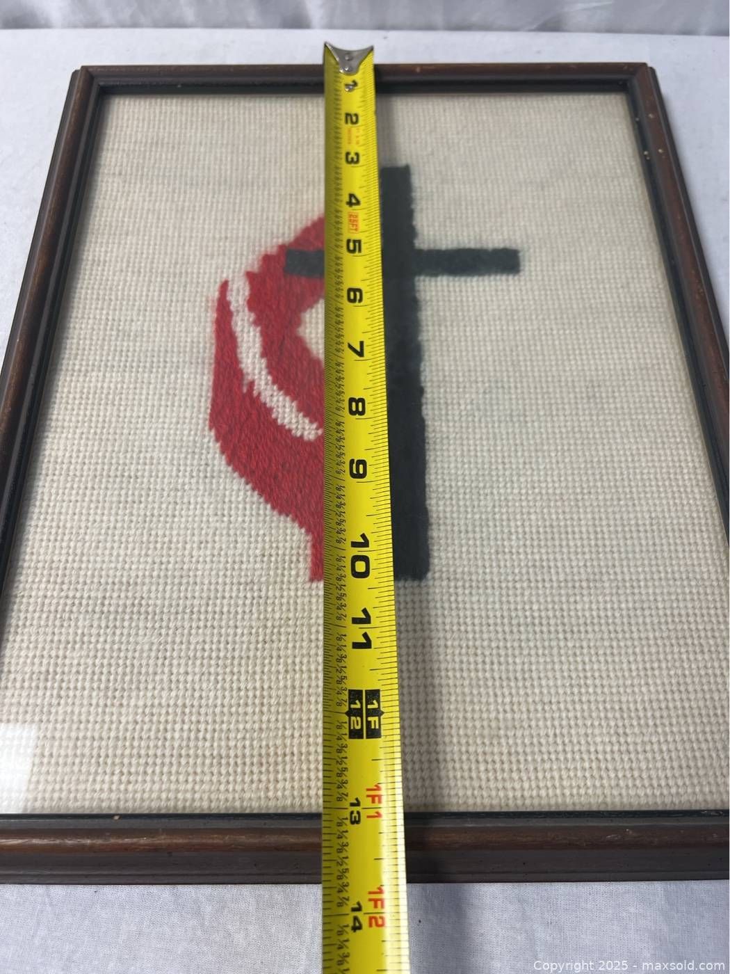 Framed needlepoint cross and flame textile art | Maxsold