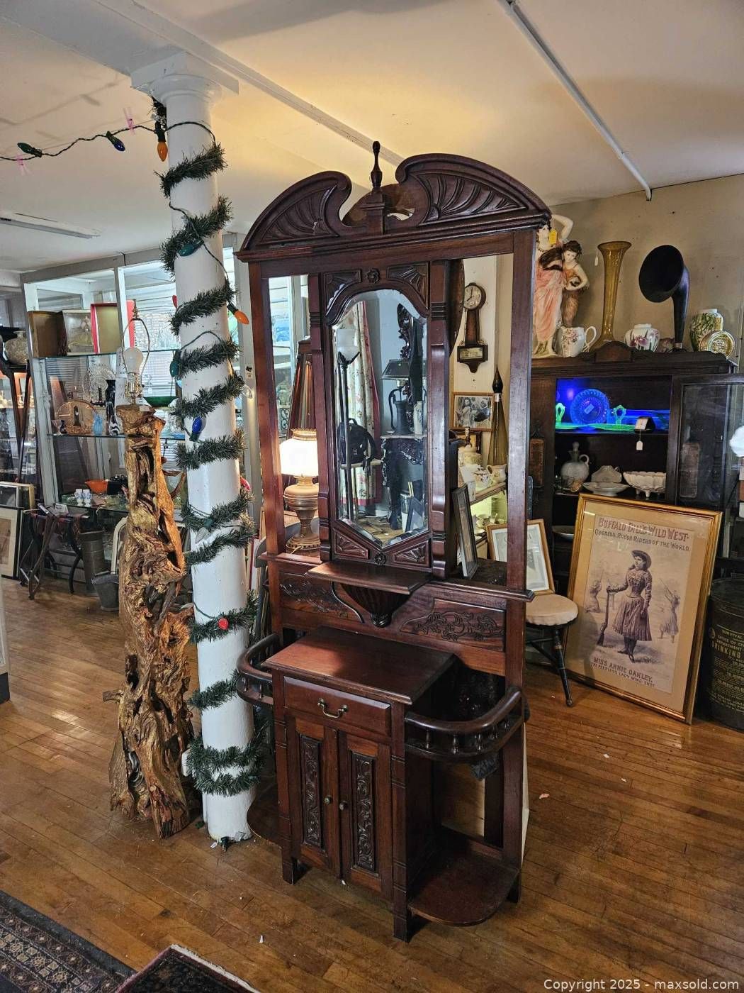 Mahogany Victorian-style hall tree with mirror and storage | Maxsold