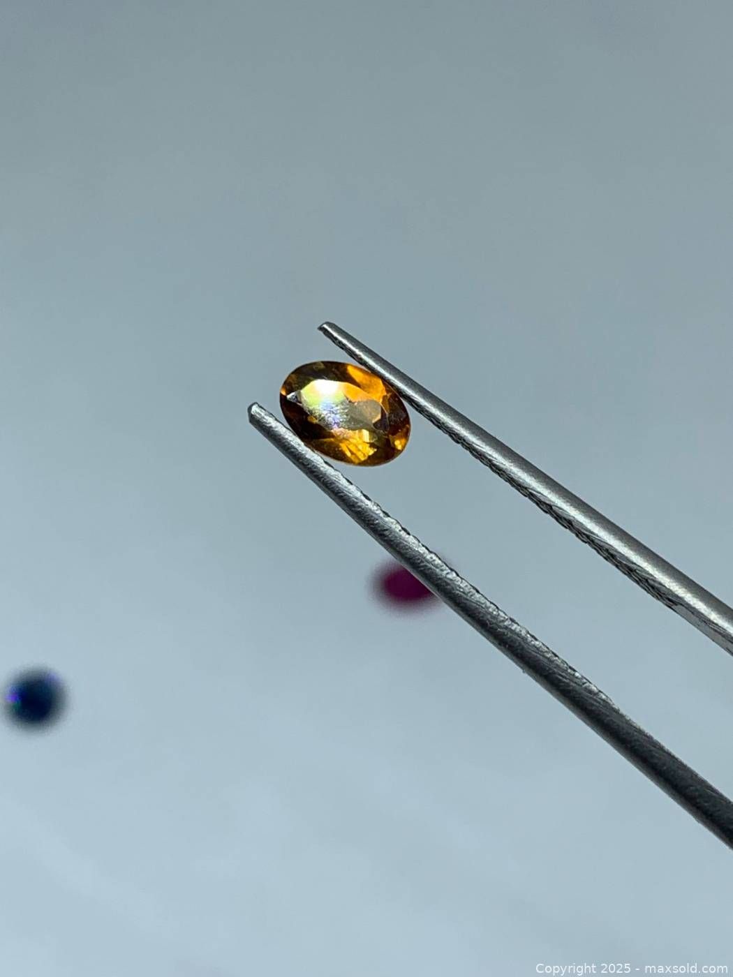 0.46ct golden orange oval tourmaline gemstone | Maxsold