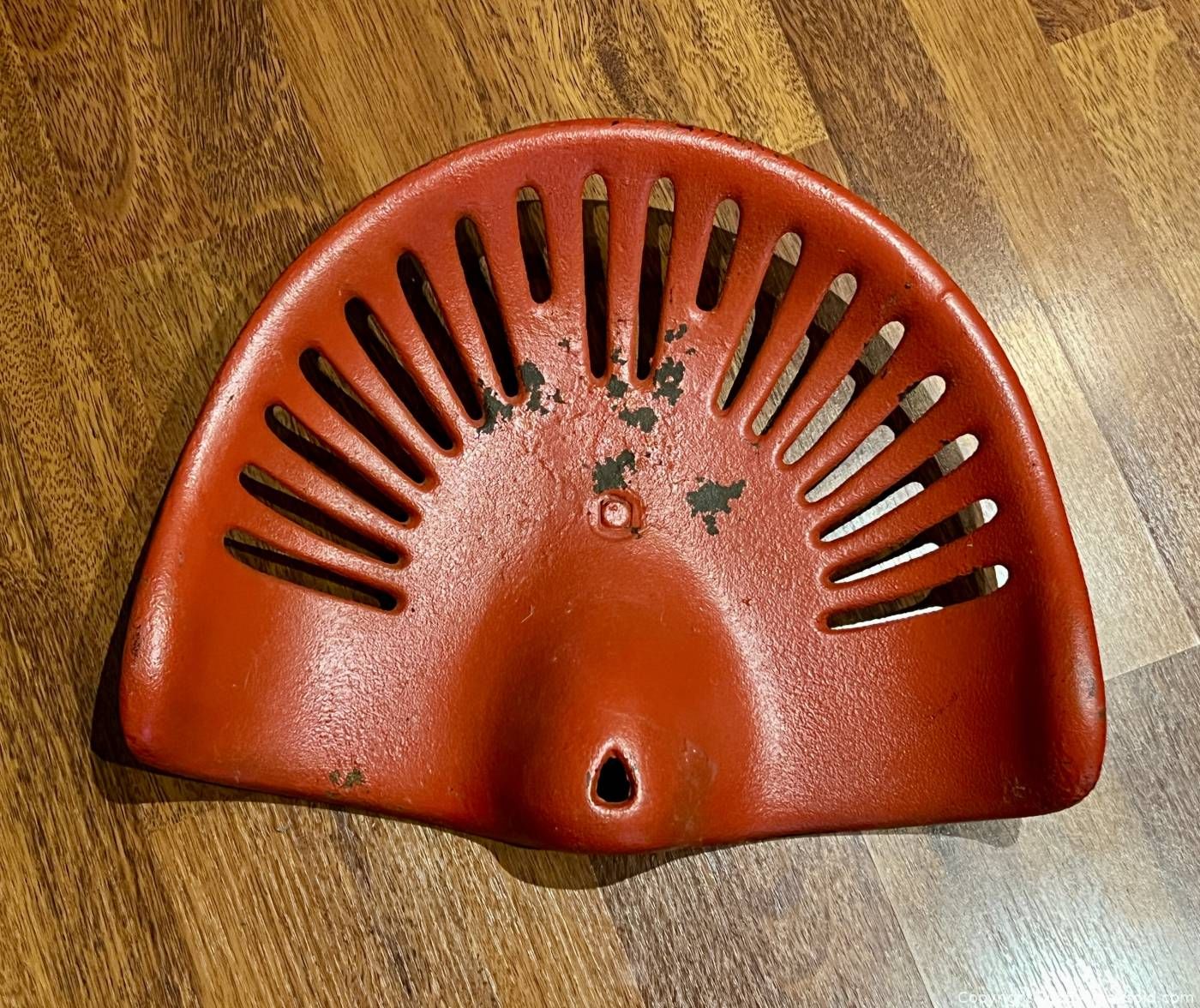 Vintage red cast-iron tractor seat | Maxsold