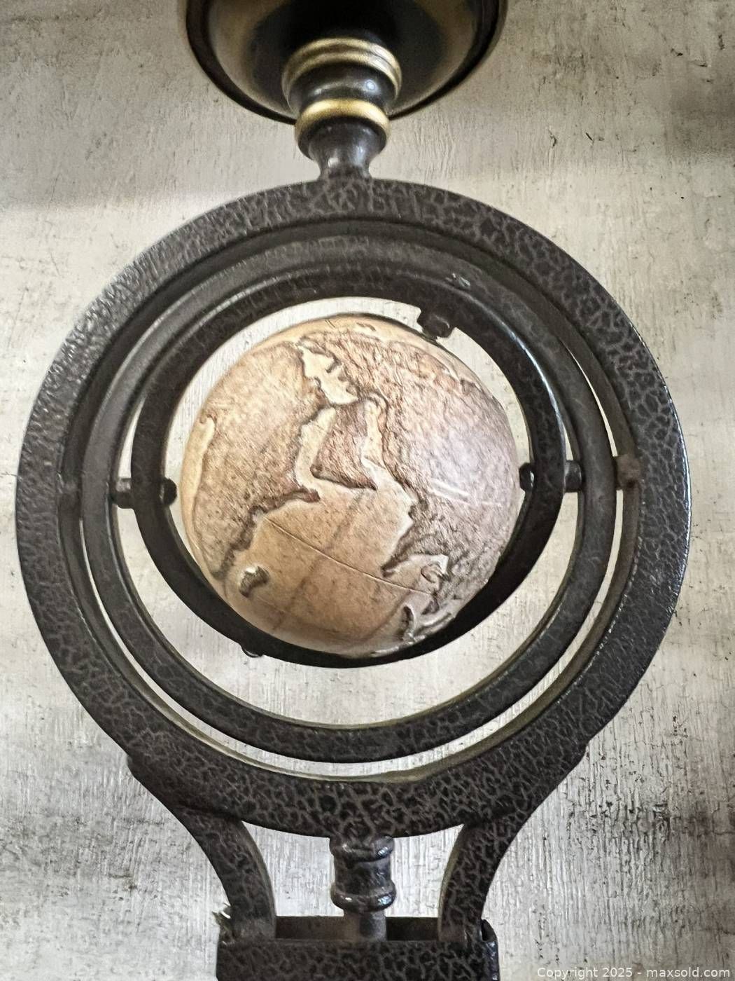 A Pair of World Globe inside Rotating Spheres Cast Iron Table Lamp ...