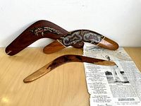 3 vintage Australian wooden boomerangs and instructional sheet | Maxsold