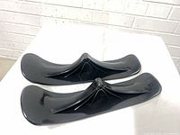 Pair of black plastic snow sled runners | Maxsold