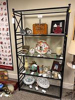 Wrought iron and glass display case | Maxsold