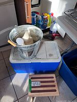 Coleman cooler, bucket, stool, Dustbuster, cleaning items | Maxsold