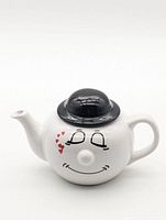 Smiley face teapot with hat lid | Maxsold