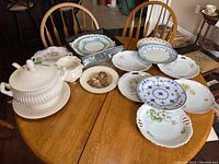 Ceramic Tureen with Ladle, Decorative Plates, Canisters, and Bowls ...